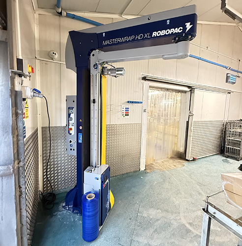 Rotating arm pallet wrapper boosts milk bottle stability for dairy farm ...